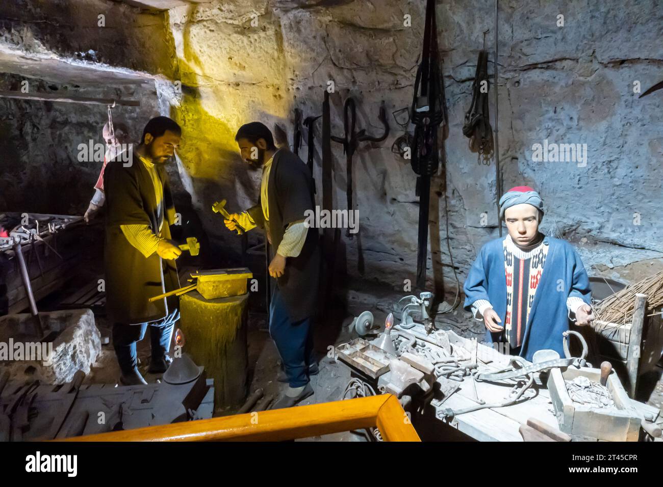Installation depicting historic metal works workshop, smiths, craafts ...