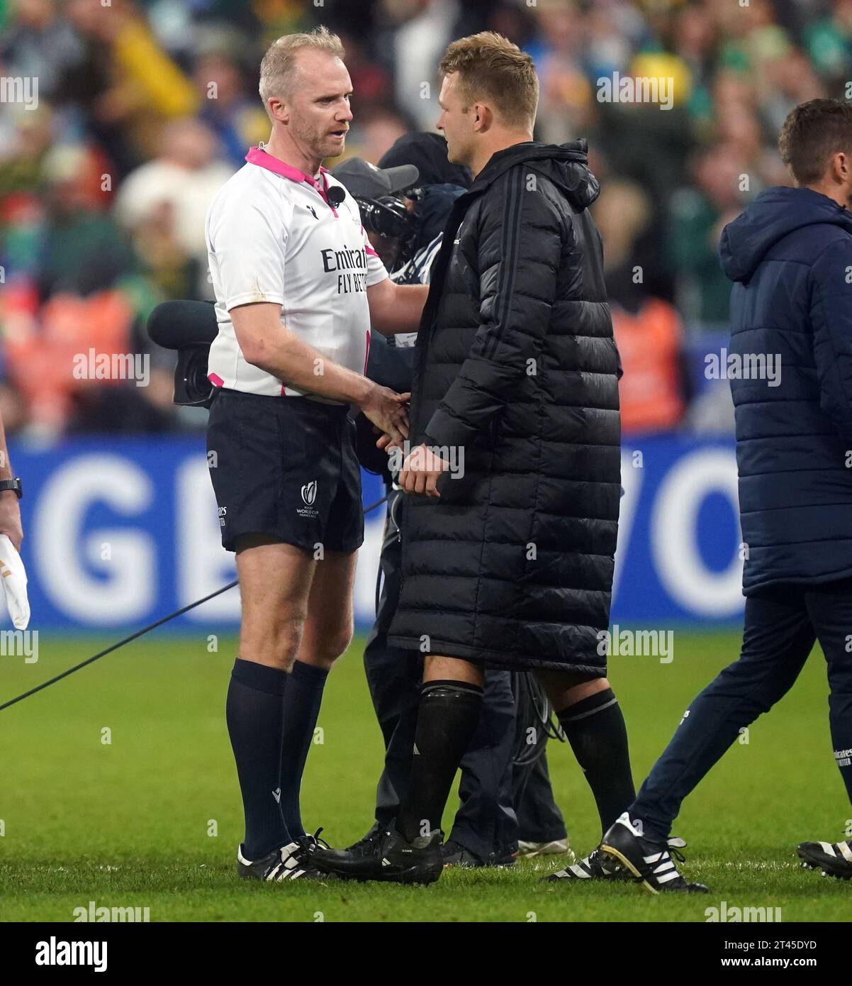 New Zealand's Sam Cane, who was shown a red card, with Referee Wayne ...