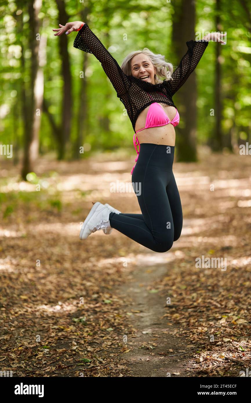Woman making dance jump hi-res stock photography and images - Alamy