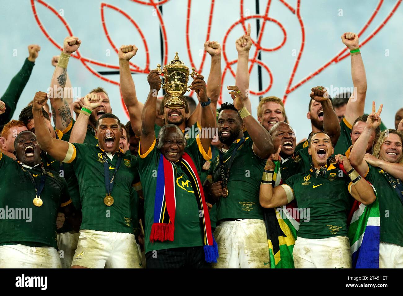 South African President Cyril Ramaphosa lifts the Webb Ellis Cup with ...