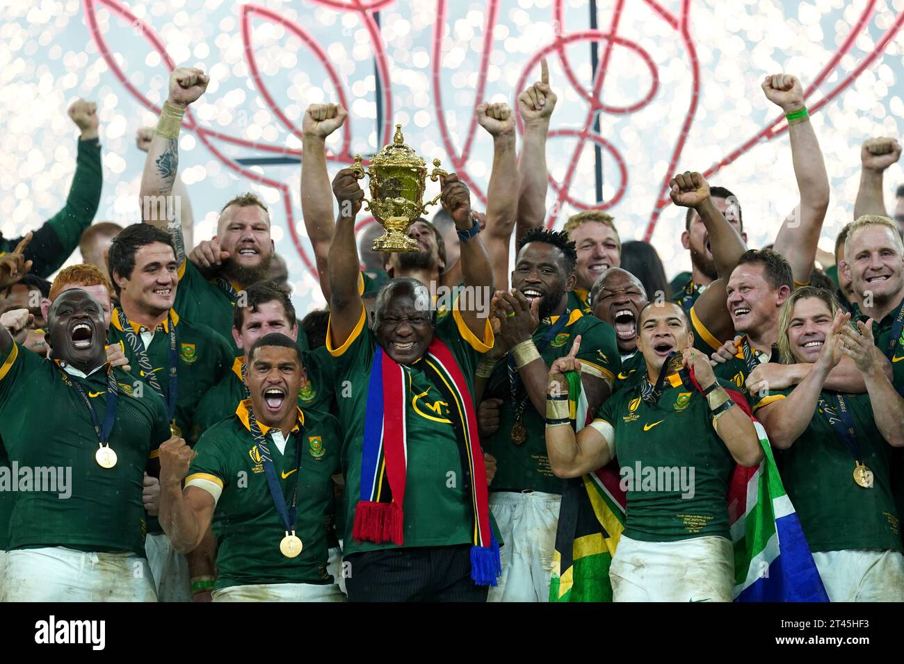 South African President Cyril Ramaphosa lifts the Webb Ellis Cup with ...