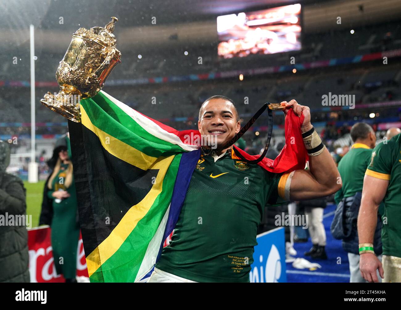 South Africa's Cheslin Kolbe celebrates with the Webb Ellis Cup ...