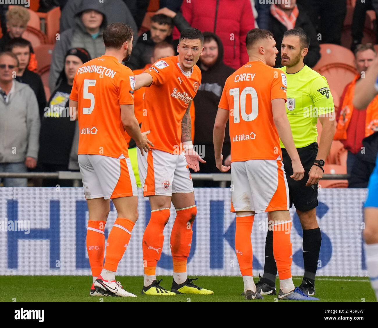 Oliver Casey #20 of Blackpool appeals to referee Ben Atkinson after ...