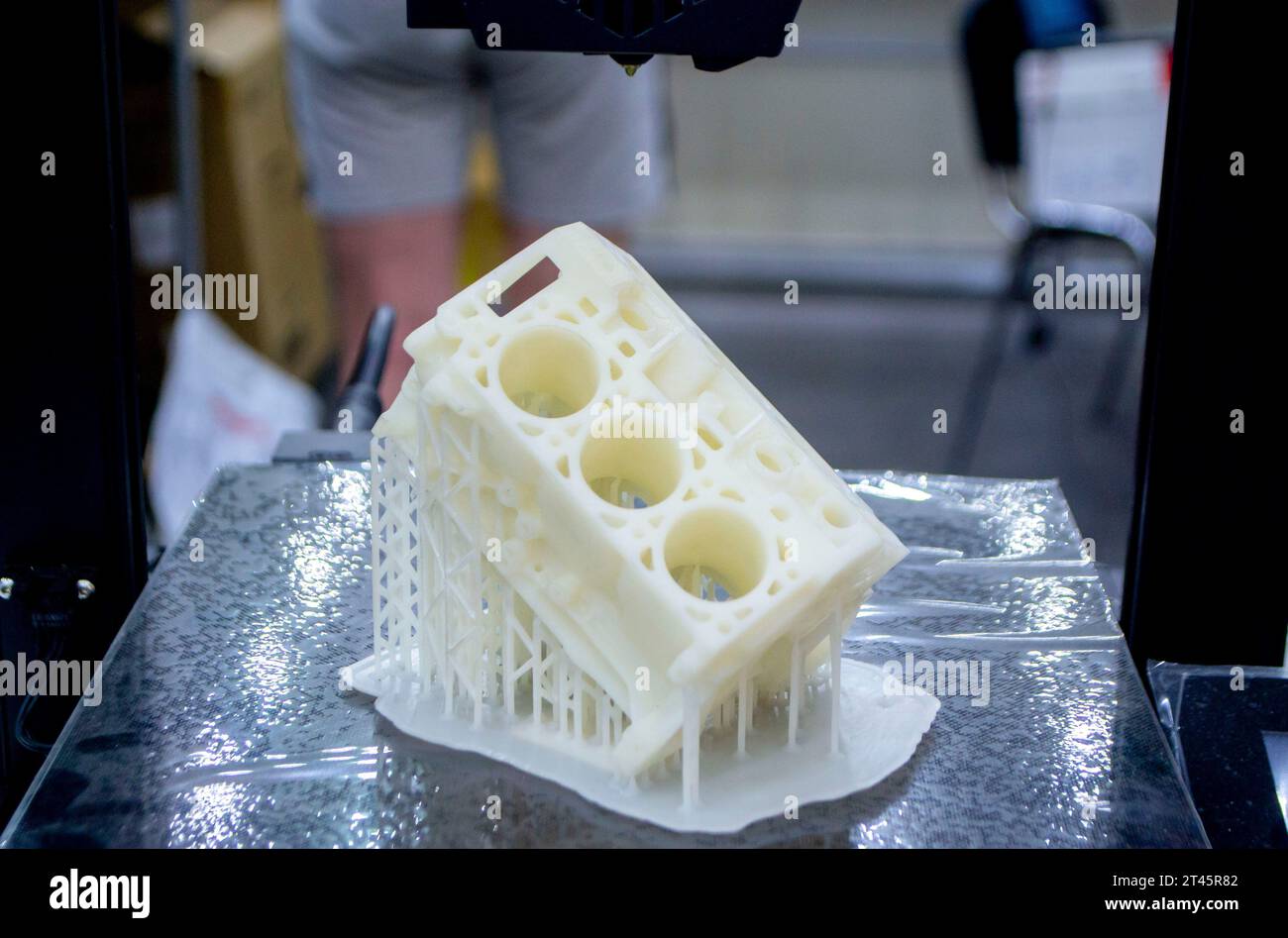 Prototype of car engine printed on 3D printer from molten white plastic ...