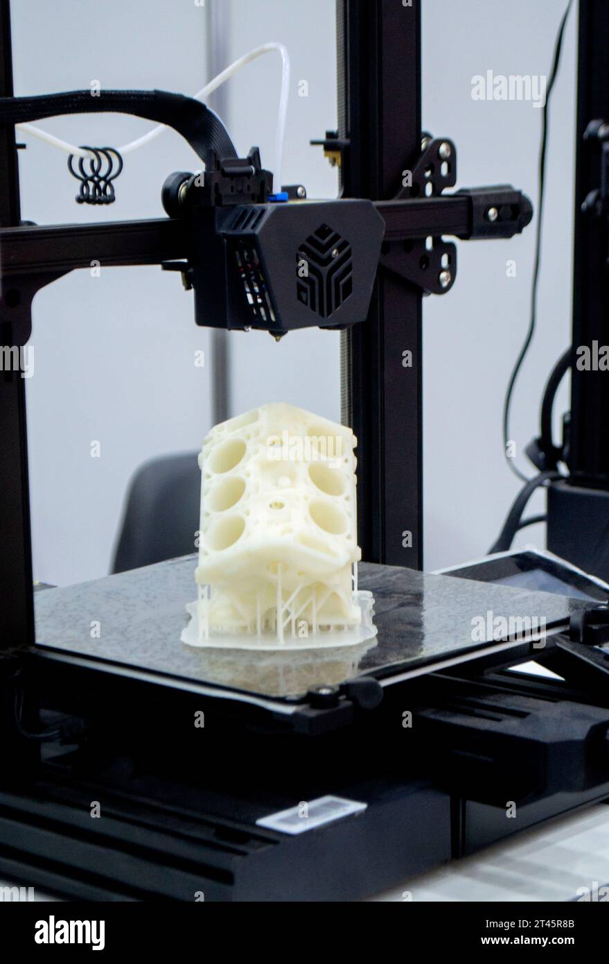 Prototype of car engine printed on 3D printer from molten white plastic ...