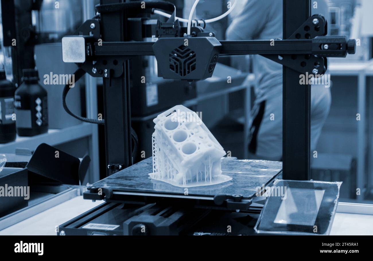 Prototype of car engine printed on 3D printer from molten white plastic ...