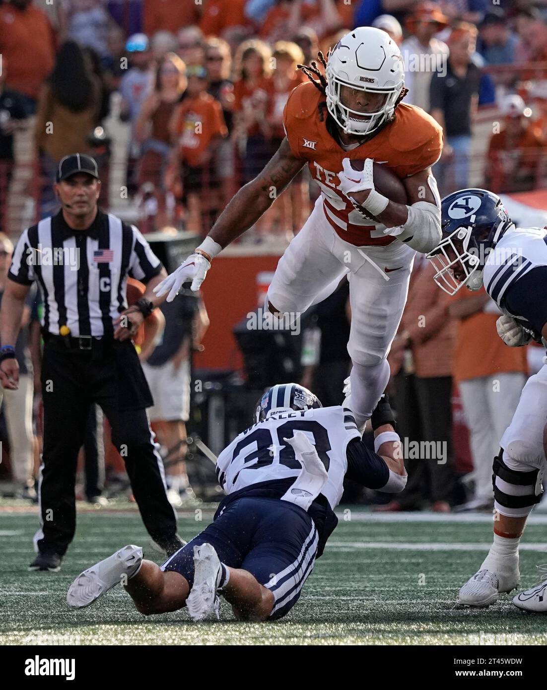 Texas running back Jonathon Brooks (24) is upended by BYU safety Crew ...