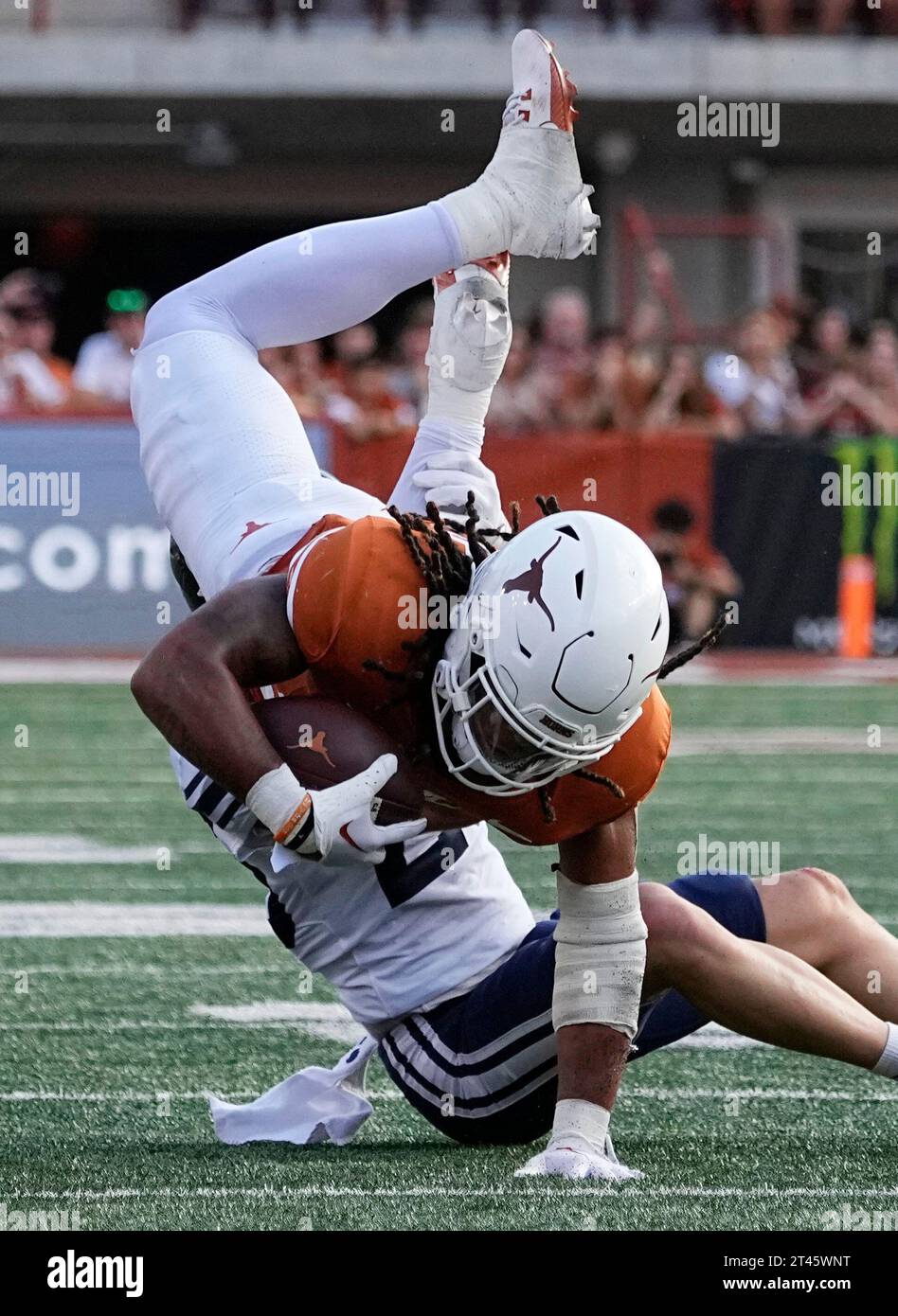 Texas running back Jonathon Brooks (24) dives over BYU safety Ethan ...