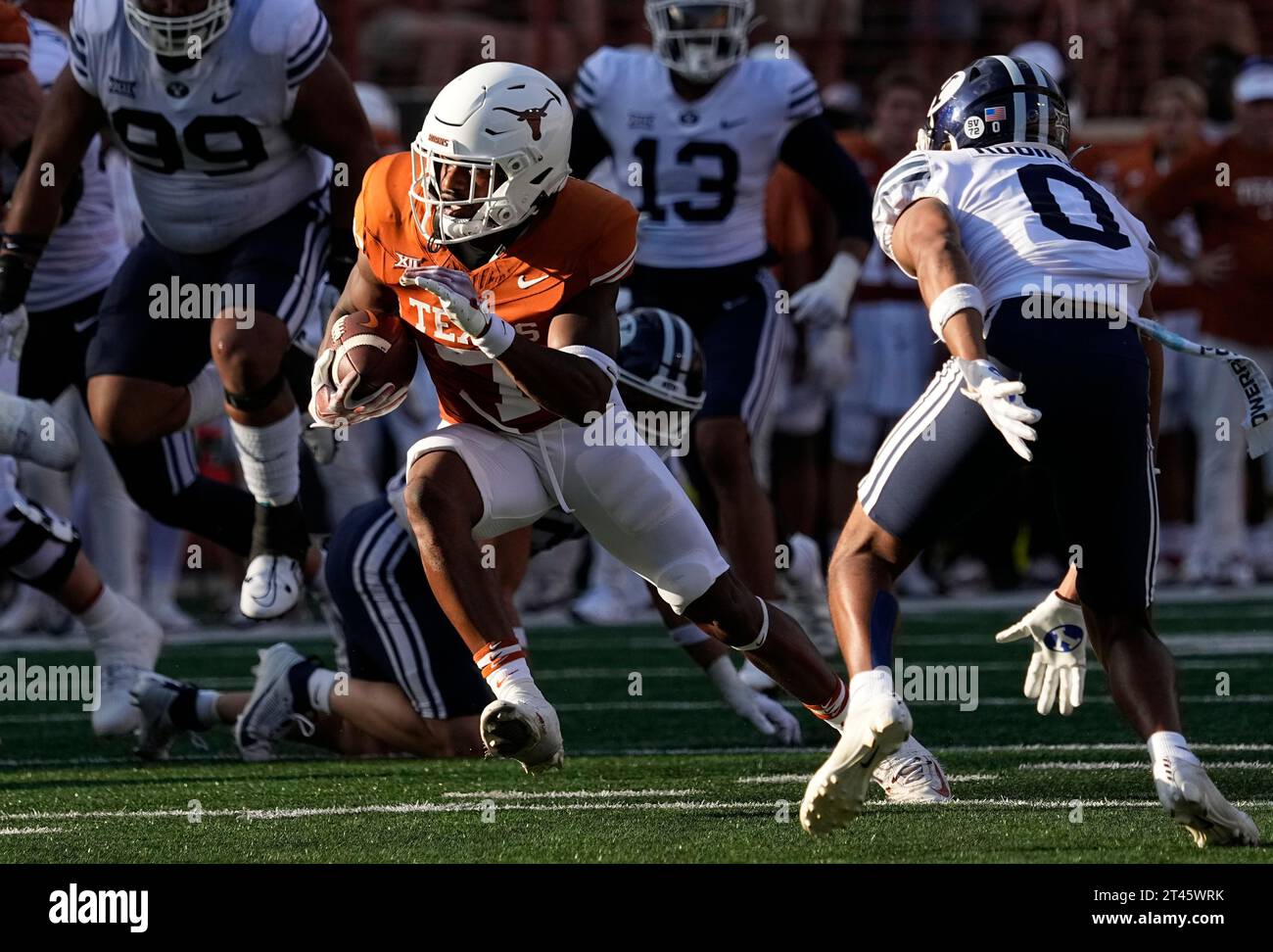 Texas running back Keilan Robinson (7) runs past BYU cornerback Jakob ...