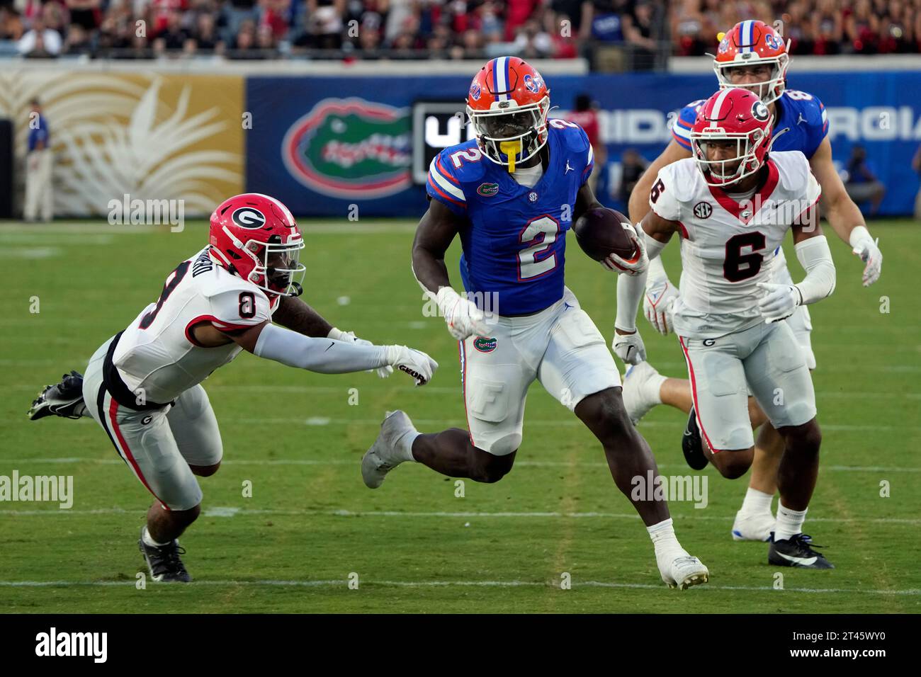 Florida running back Montrell Johnson Jr. (2) finds room to run as he ...