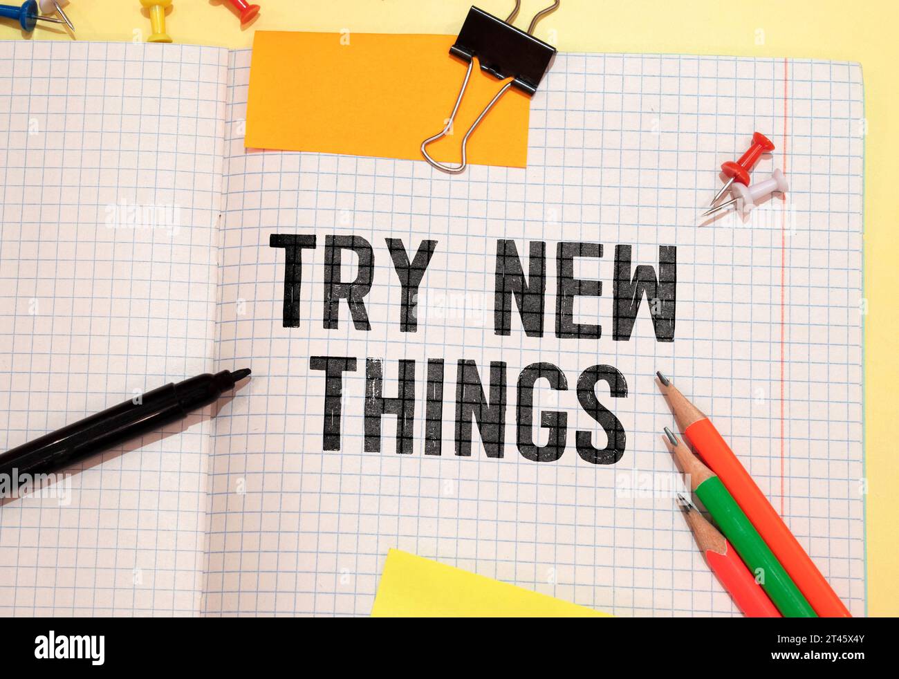 Try new things text on table background Stock Photo - Alamy