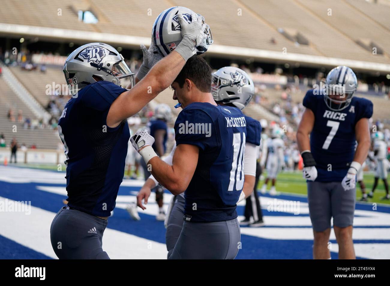 Rice running back Dean Connors, left, attempts to put wide receiver ...