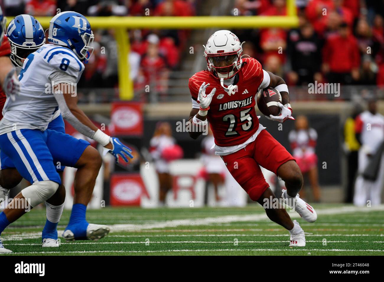 Louisville running back Jawhar Jordan (25) runs from the defense of ...