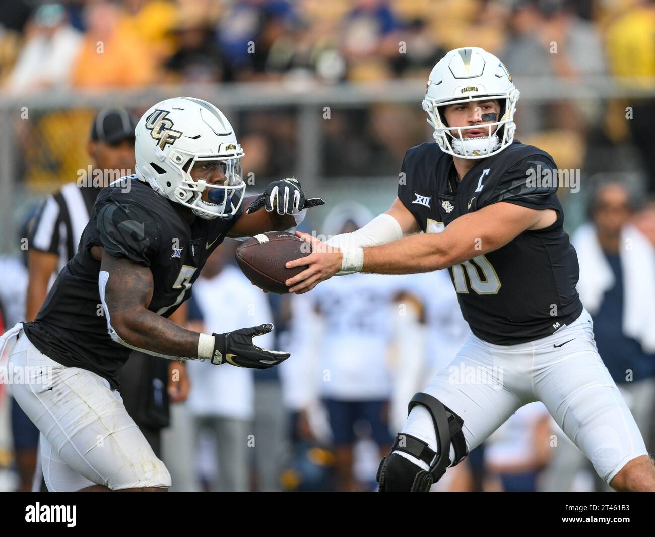 October 28, 2023: UCF quarterback John Rhys Plumlee (10) hands the ball ...