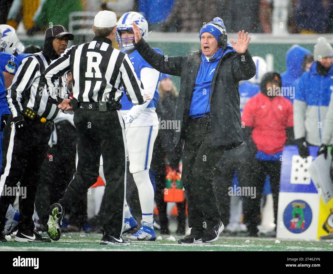 Air Force head coach Troy Calhoun, front right, argues for a call with ...