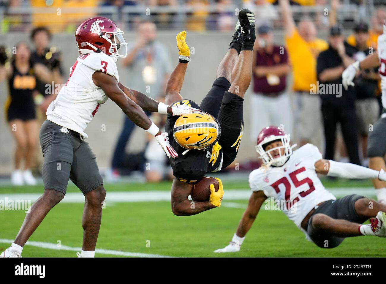 Arizona State running back DeCarlos Brooks, center, leaps over Washington State defensive back ...