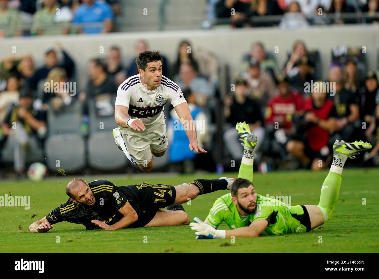 Vancouver Whitecaps forward Brian White, top watches his goal past Los ...