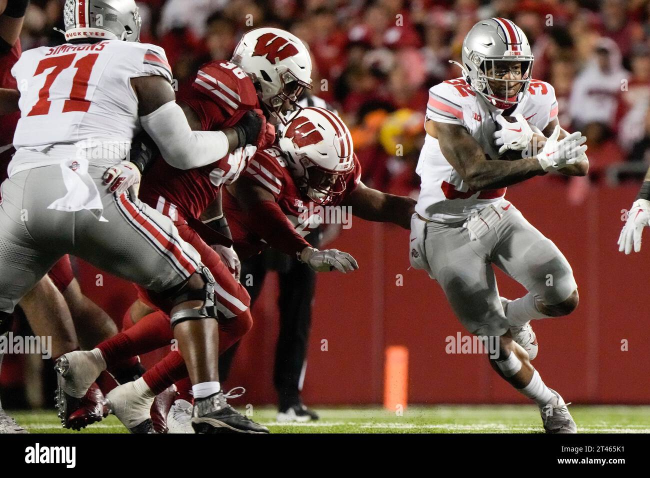 Ohio State's TreVeyon Henderson (32) runs during the first half of an ...