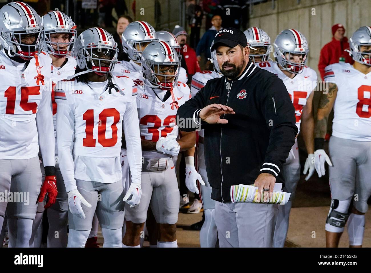 Ohio State head coach Ryan Day leads his team on the field before an ...