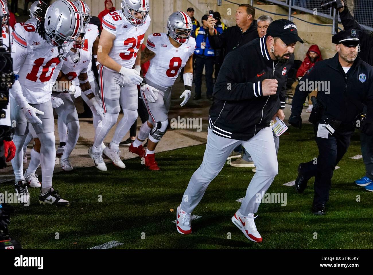 Ohio State head coach Ryan Day leads his team on the field before an ...