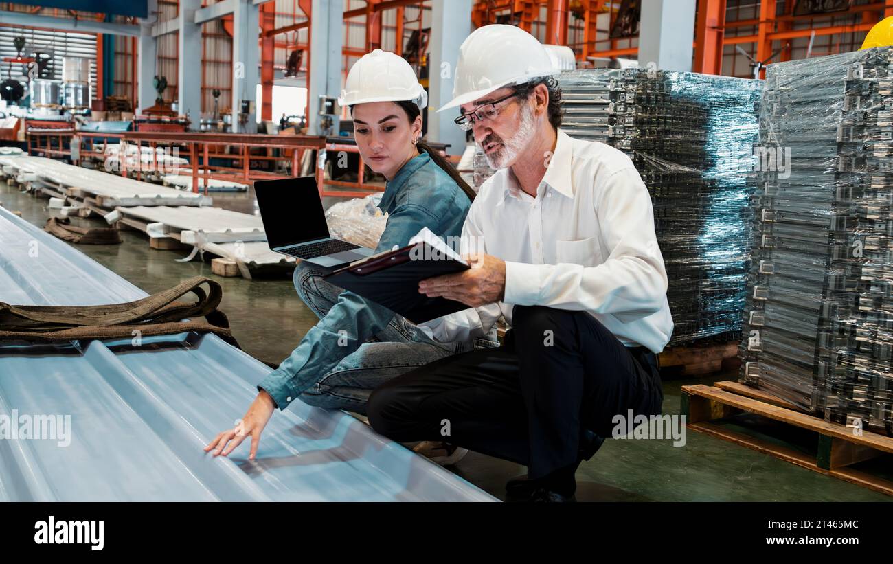 Metalwork manufacturing factory manager inspect newly manufactured ...