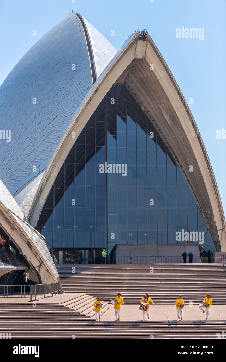 A drumming and dance troupe perform on the steps of Sydney Opera House ...
