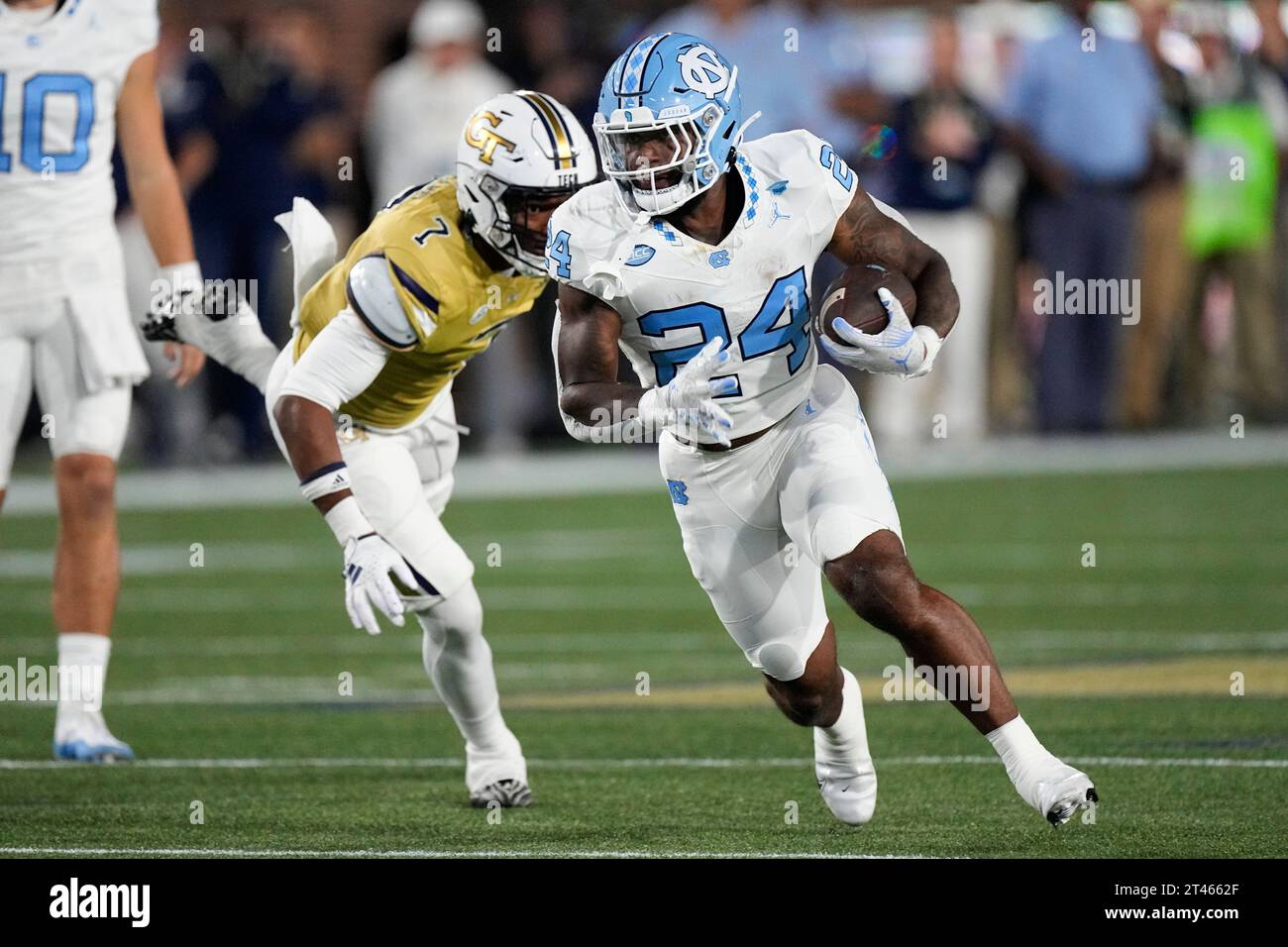 North Carolina running back British Brooks (24) runs away from Georgia ...
