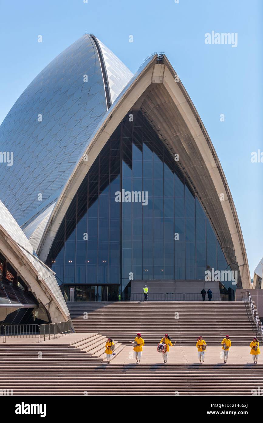 A drumming and dance troupe perform on the steps of Sydney Opera House ...