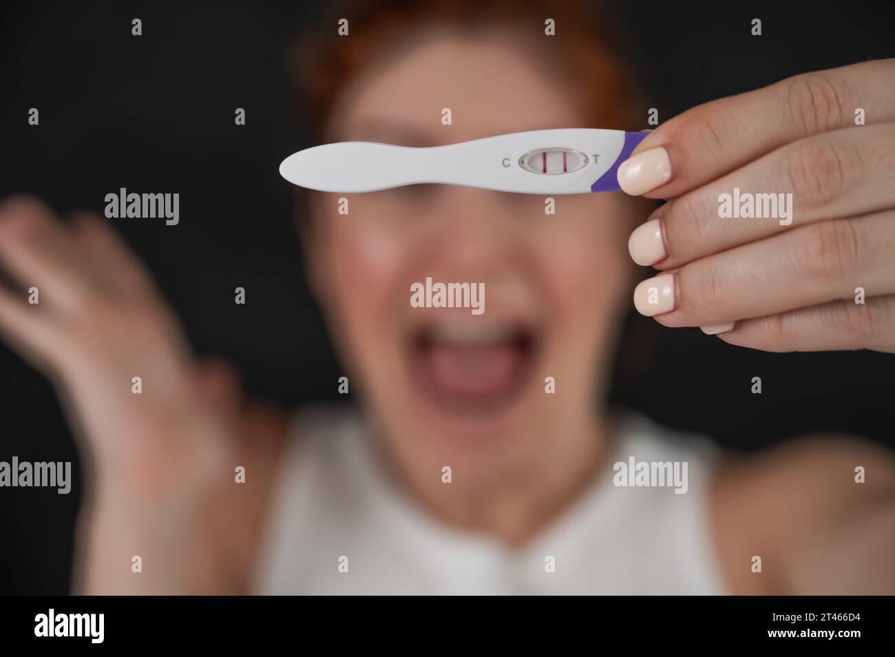 Blurred portrait of upset caucasian woman holding positive rapid ... Blurred portrait of upset caucasian woman holding positive rapid ...