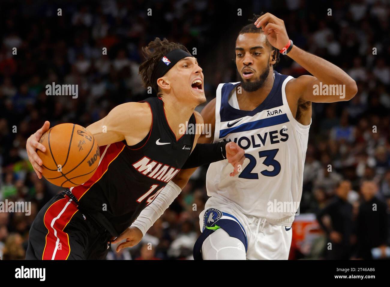 Miami Heat guard Tyler Herro (14) works past Minnesota Timberwolves ...