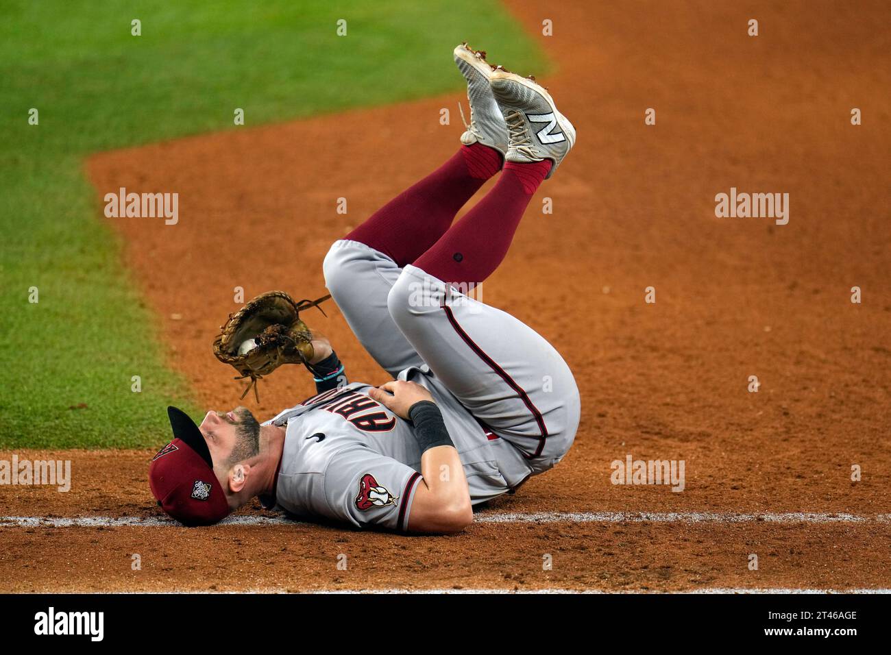 Arizona Diamondbacks first baseman Christian Walker falls backward ...