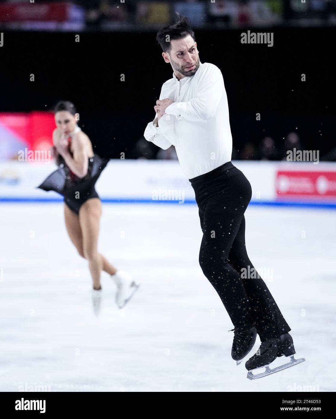 Deanna Stellato-Dudek and Maxime Deschamps of Canada skate during the ...