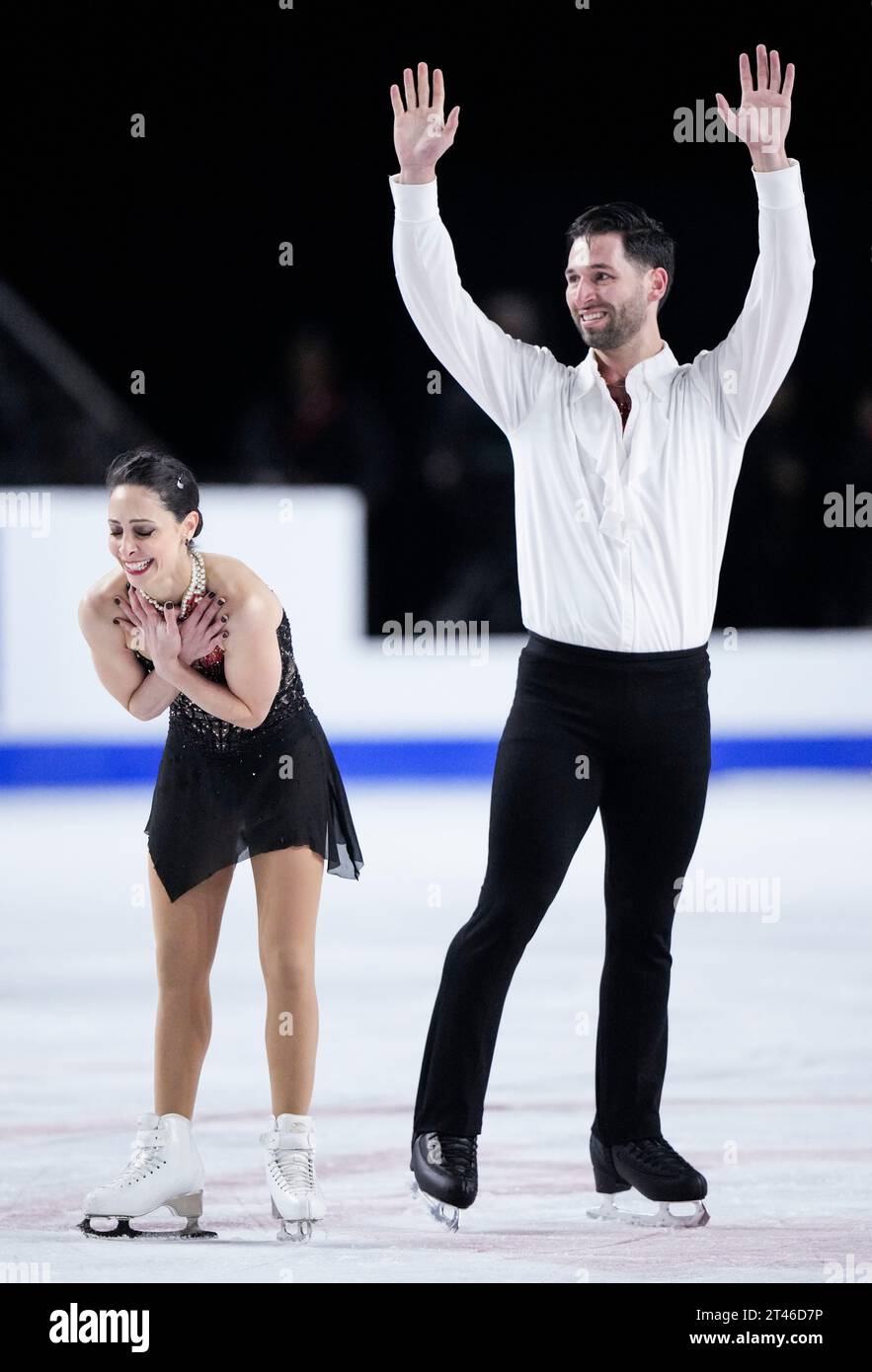 Deanna Stellato-Dudek and Maxime Deschamps of Canada react during the ...
