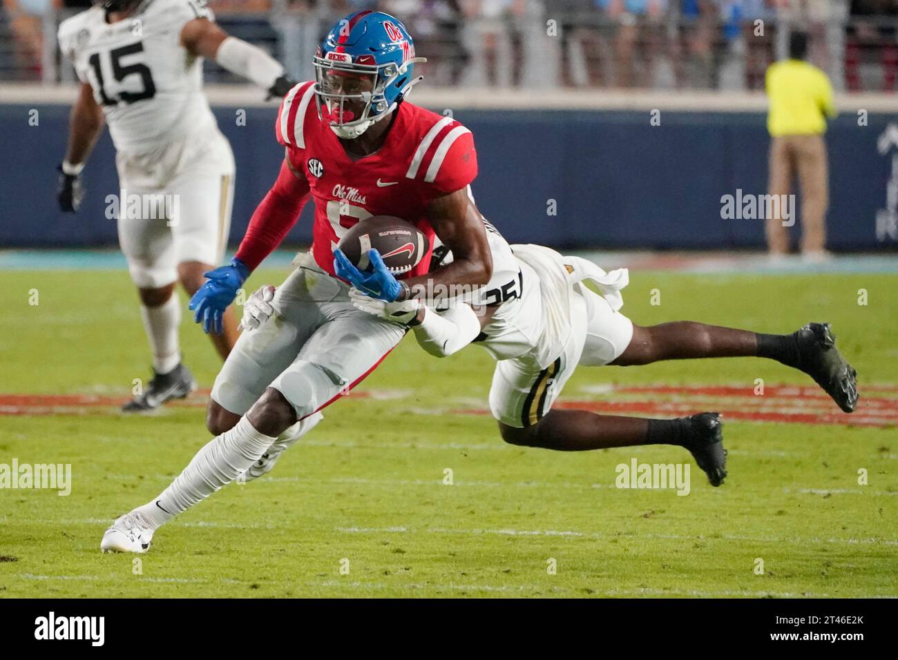 Mississippi wide receiver Tre Harris (9) tries to evade an attempted ...