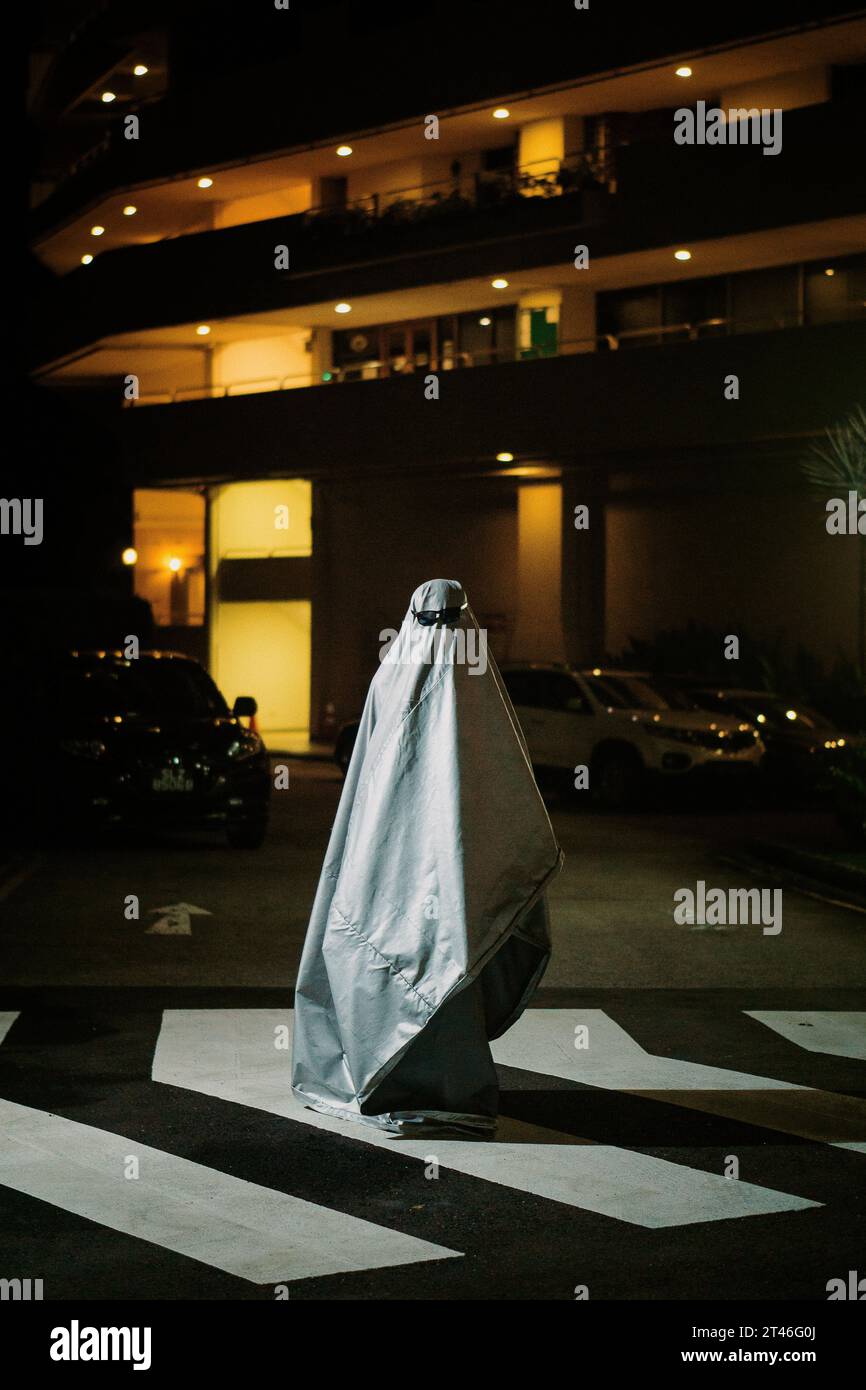 Halloween Urban Ghost on Zebra Crossing with Ominous Yellow Building ...