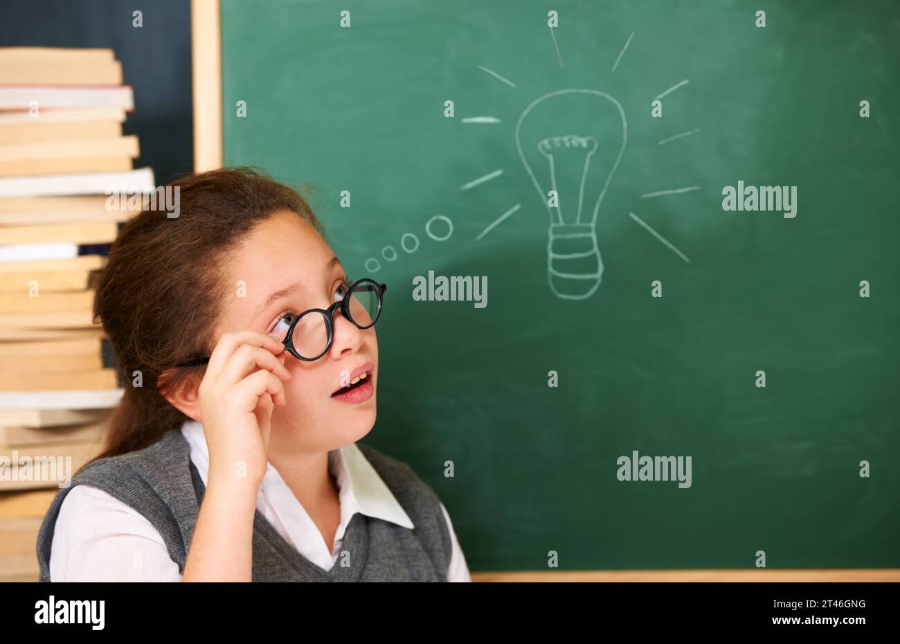 Thinking, idea and student with light bulb on board for planning ...