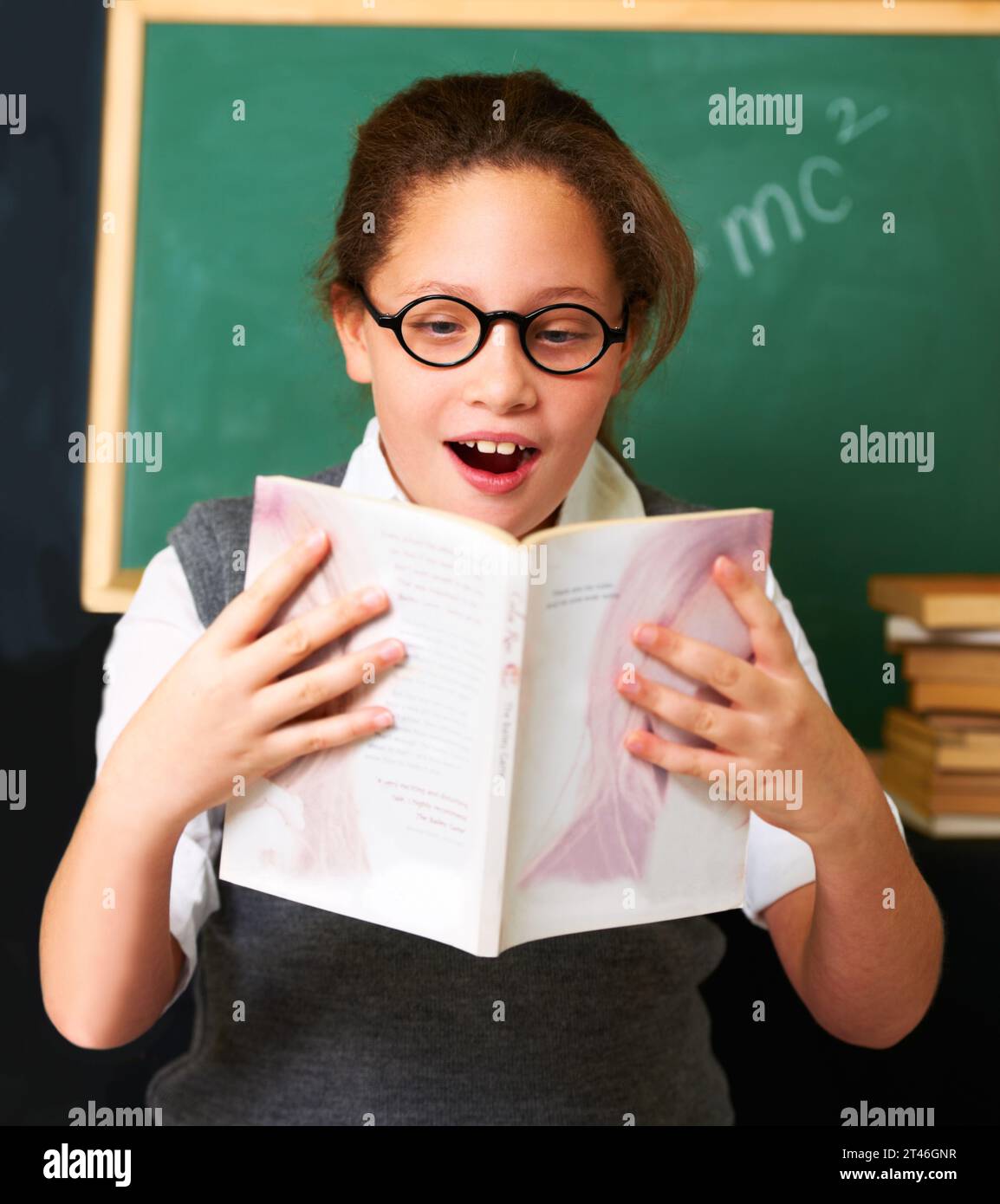 Shock, reading and child student with book in classroom for knowledge ...