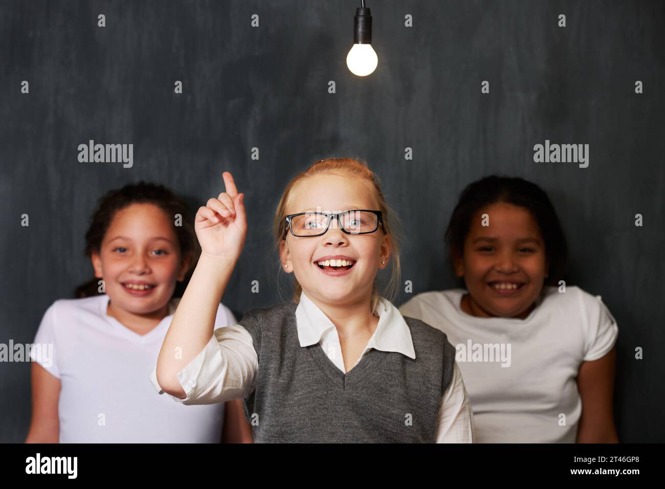 Light bulb, smile and children with idea, solution or thinking facial ...