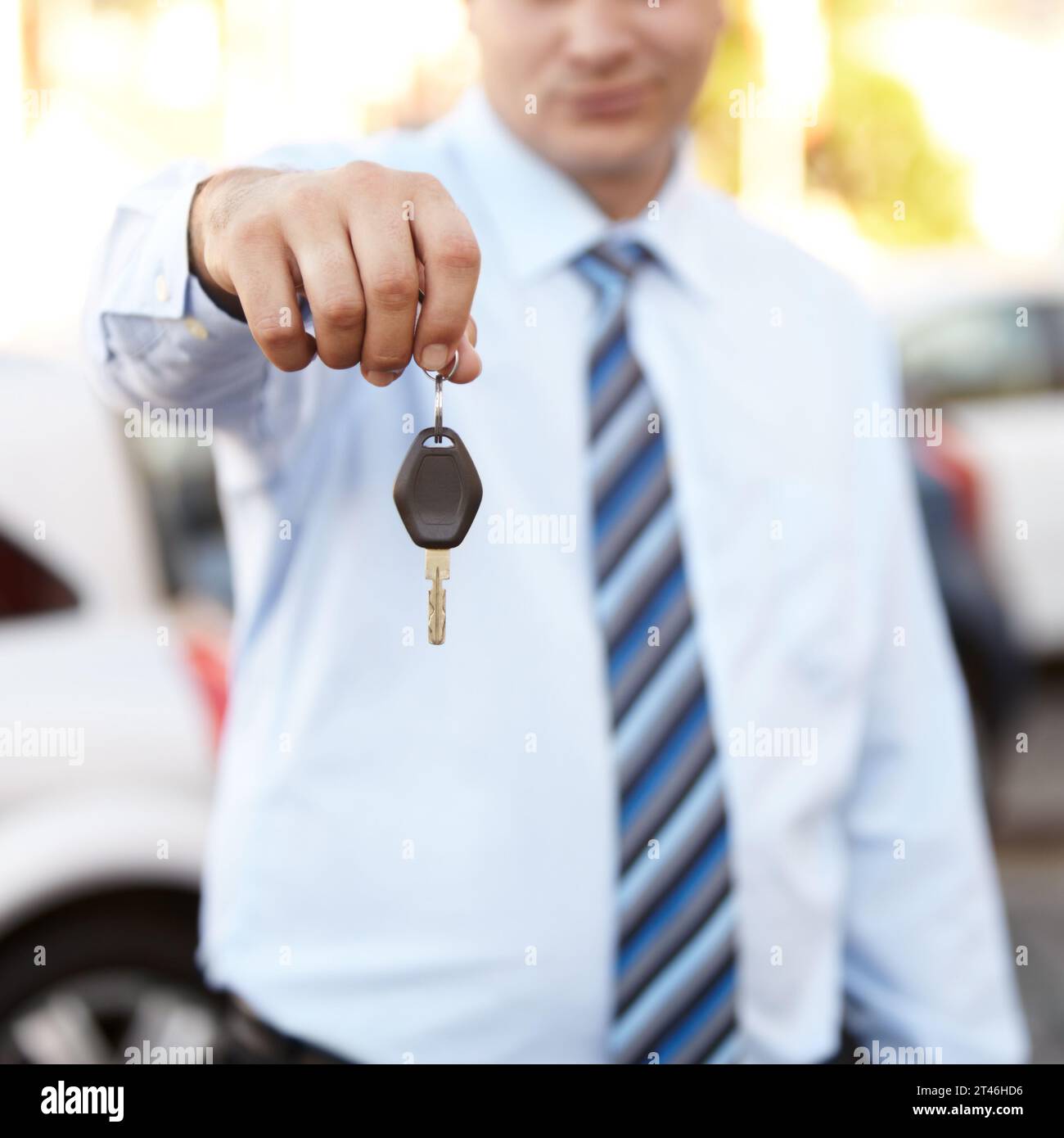 Businessman, hand and key to car outdoor with sale of auto ...