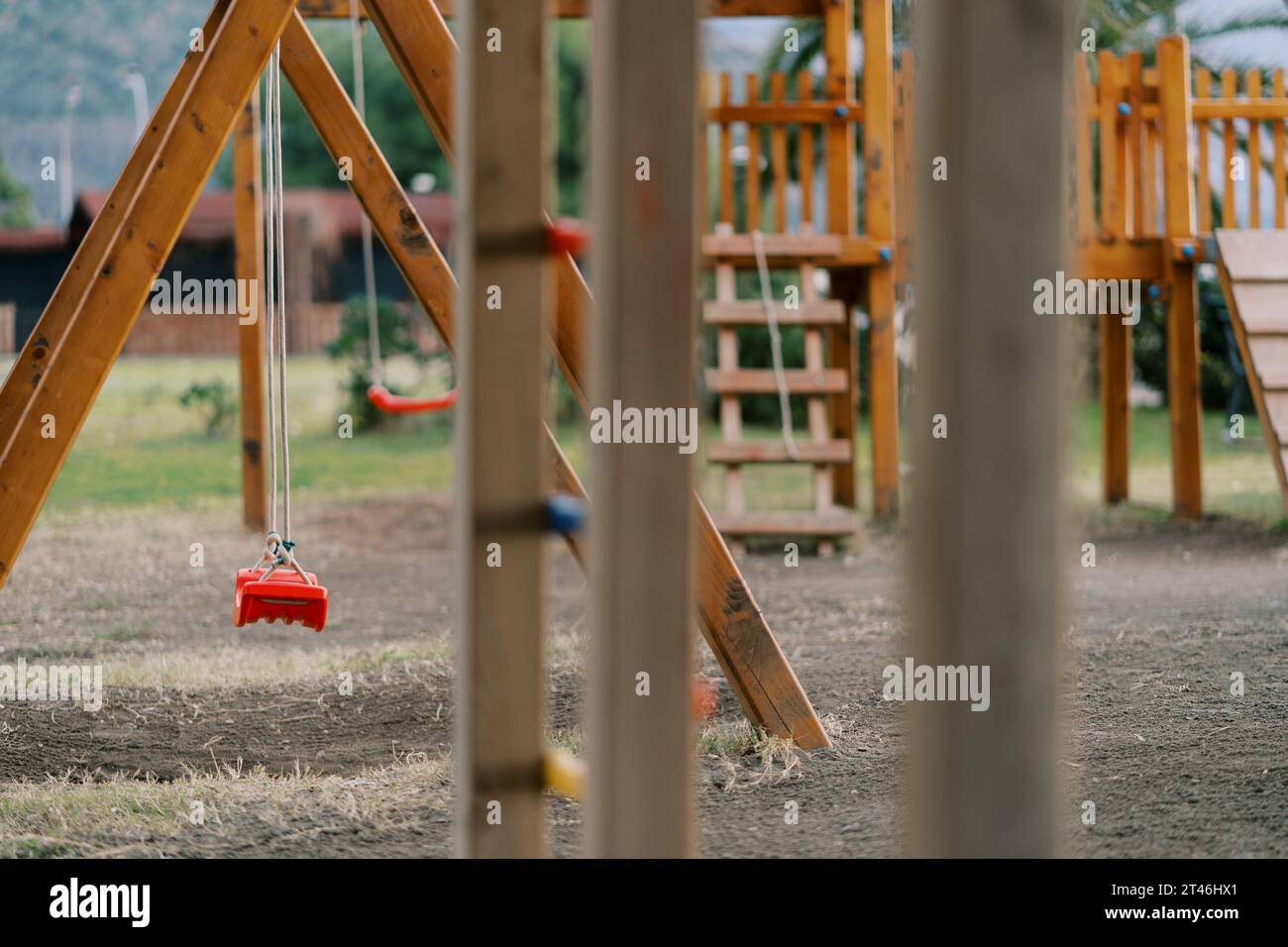 Wooden playground with swings, slides and climbing walls Stock Photo ...