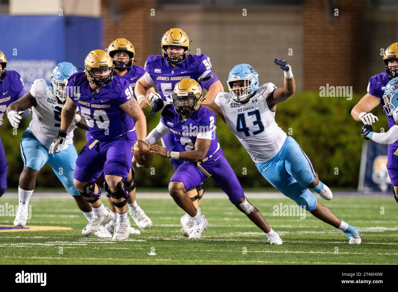James Madison quarterback Jordan McCloud (2) is about to be sacked by ...