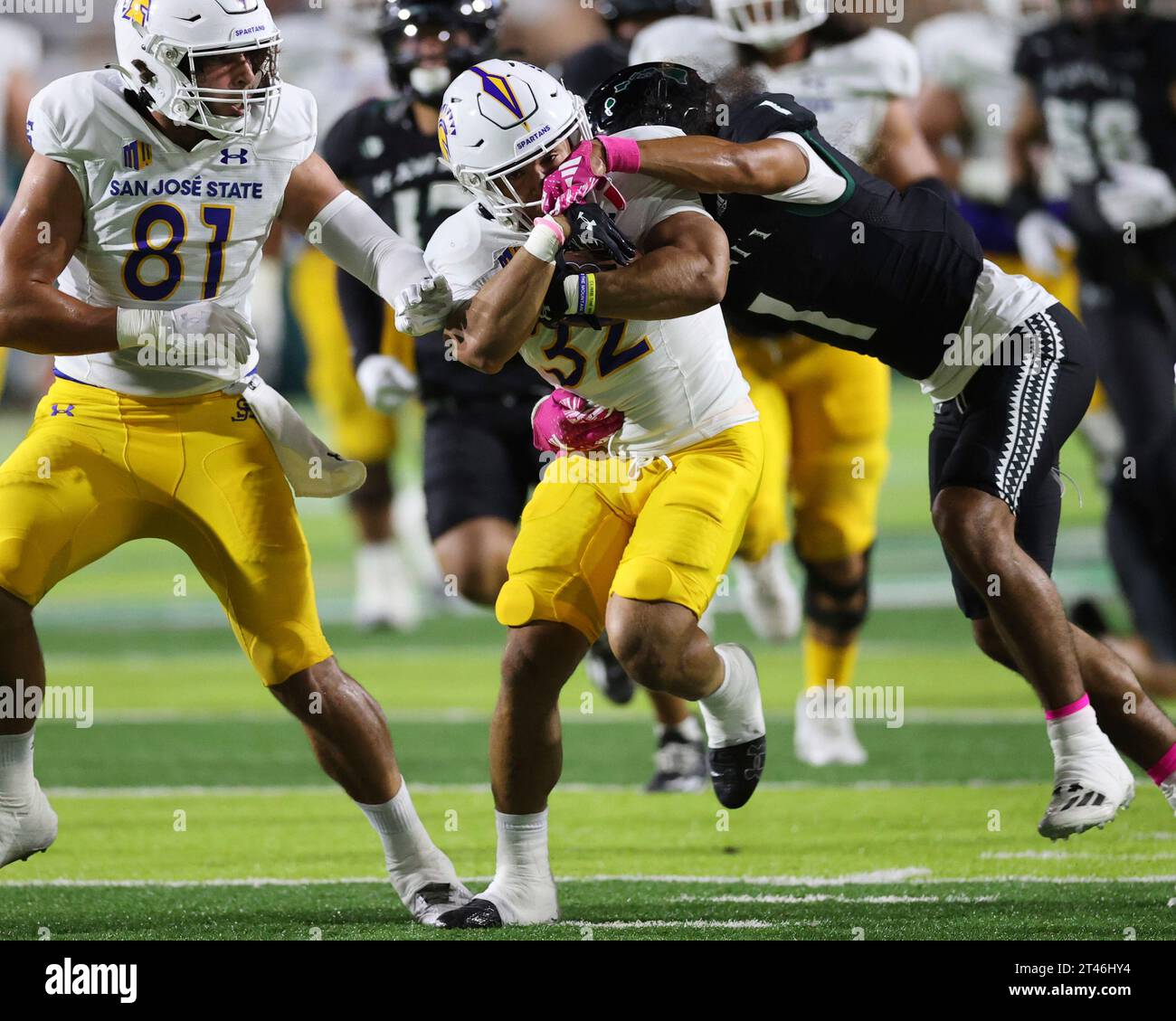 Hawaii defensive back Peter Manuma (1) tries to pull down San Jose ...