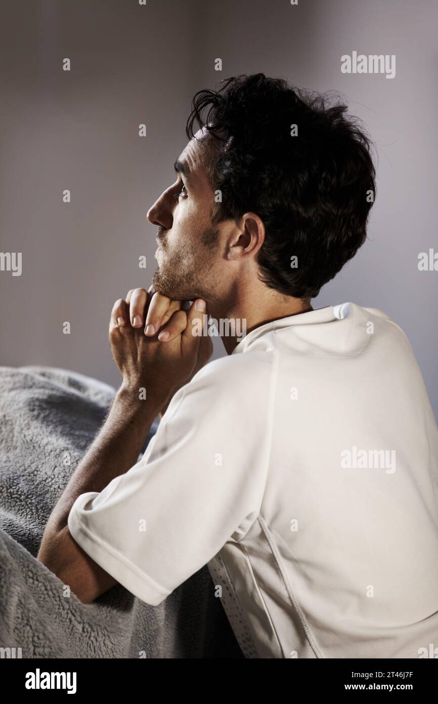 Man, praying and home for faith, religion and hope in bedroom asking ...