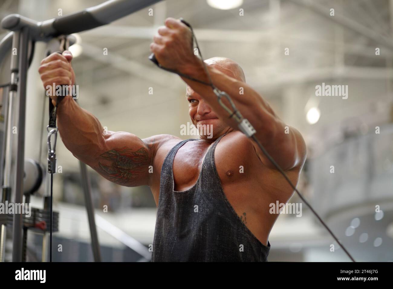 Body builder, strength exercise and man in a gym with power ...