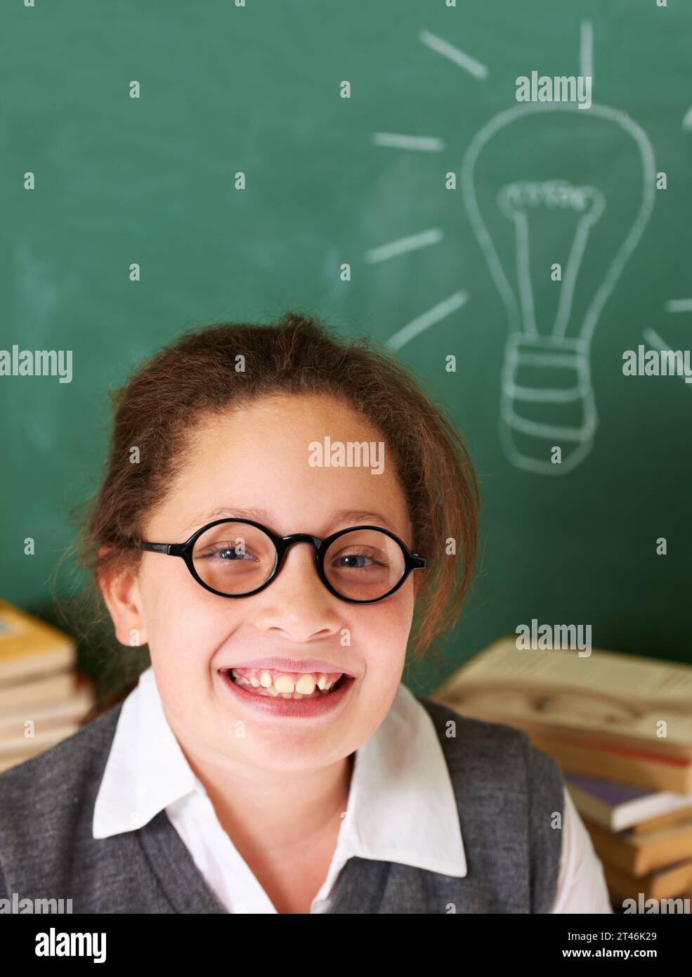 Happy, smile and portrait of student with light bulb on board for plan ...