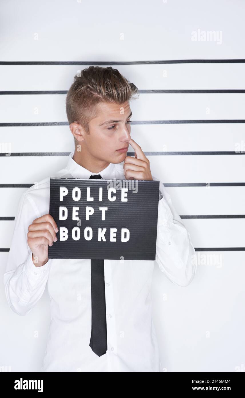 Crime, mugshot and man on a white background for suspect for criminal ...