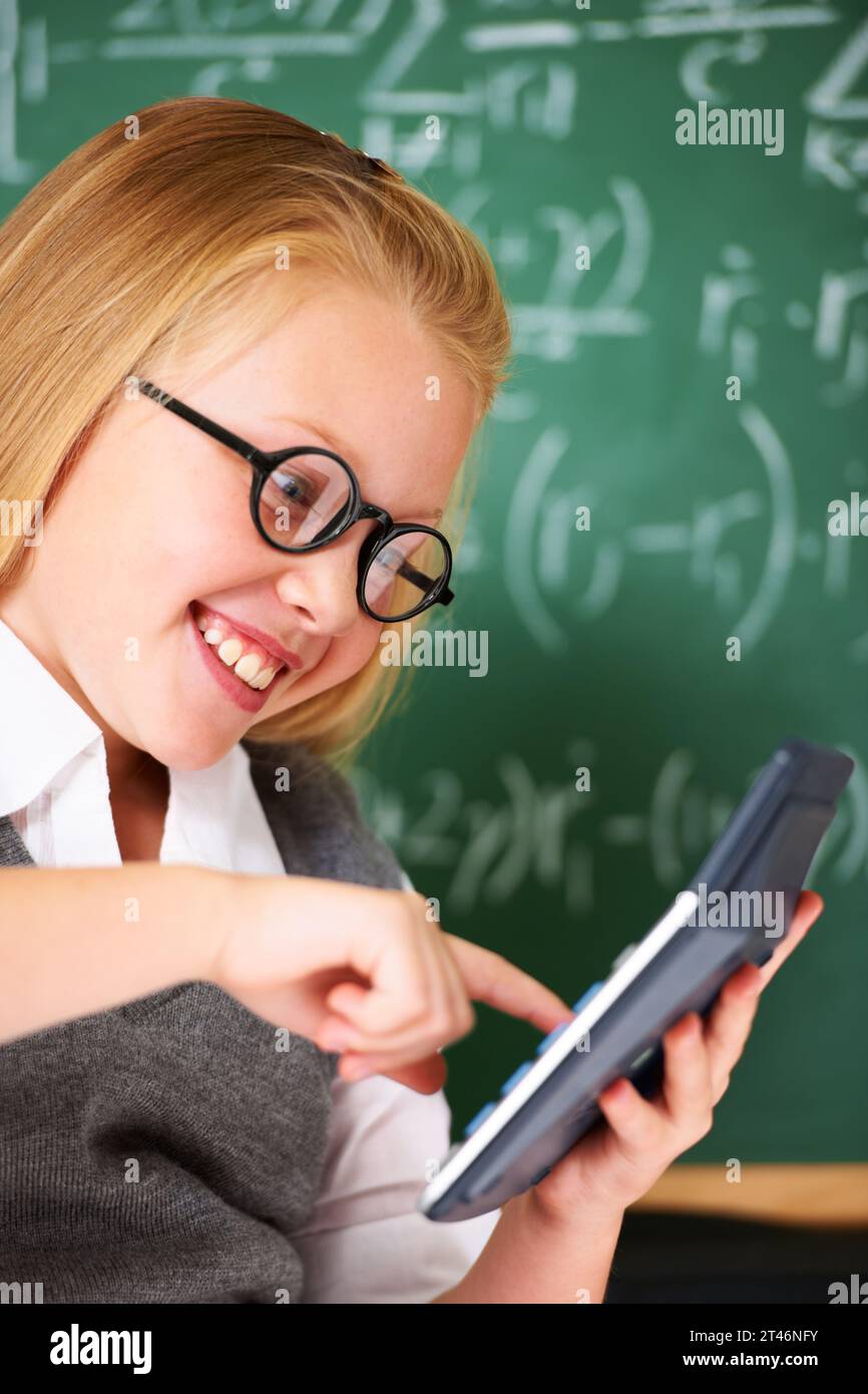 child, girl and calculator by chalkboard for happy education, learning ...