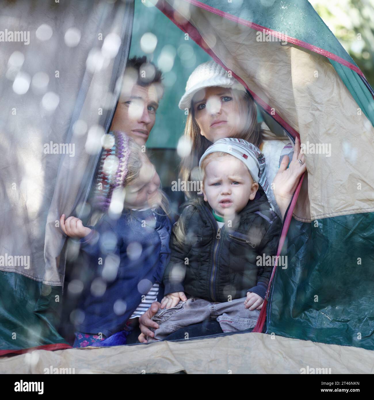 Camping, family and parents with children in rain sad for adventure ...