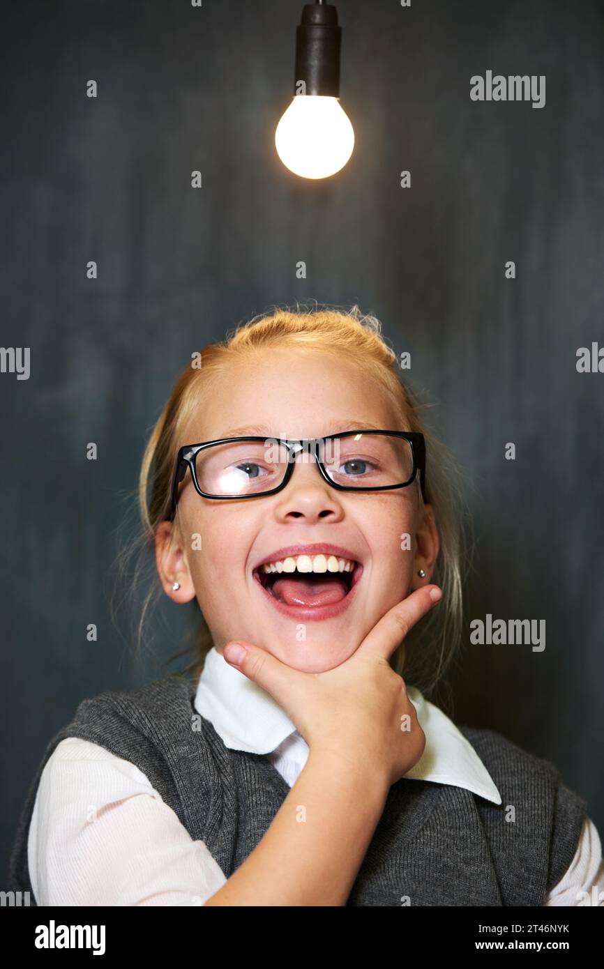 Student portrait, girl and lightbulb for solution, learning and wow ...