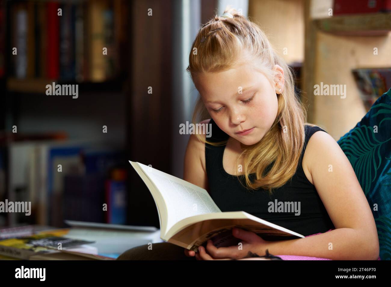 Girl, child and library for reading book, education and learning of ...